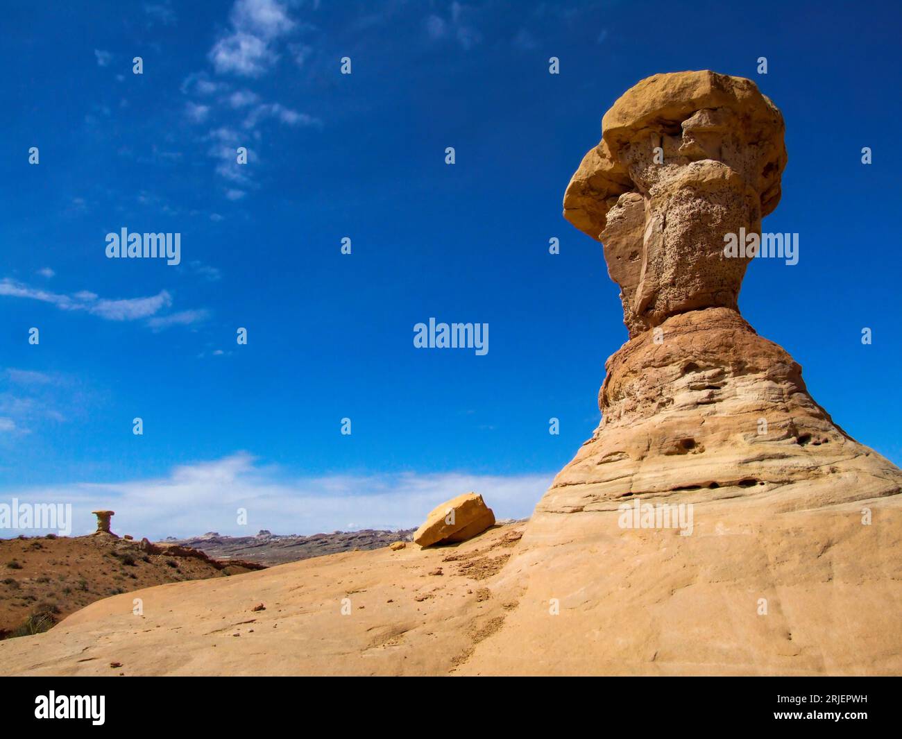 A pair of Entrada Sandstone hoodoos face each other in the San Rafael ...