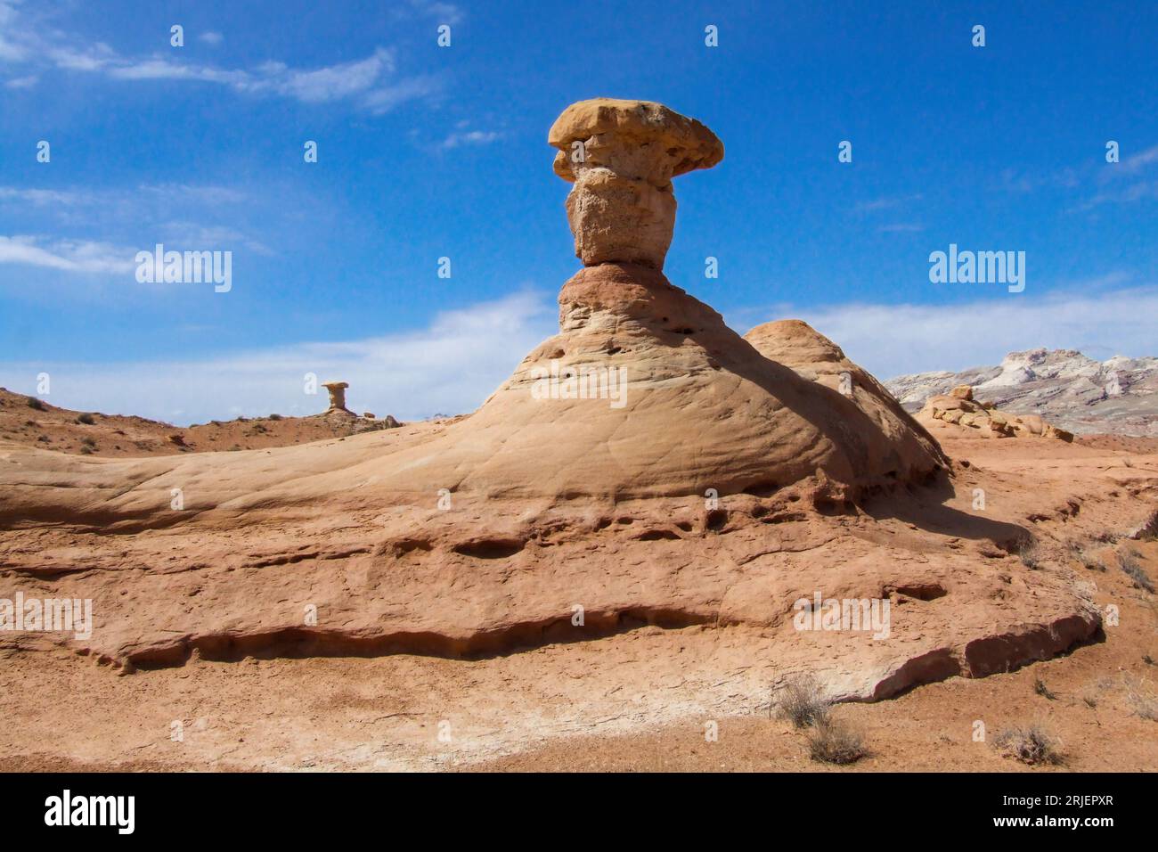 A pair of Entrada Sandstone hoodoos face each other in the San Rafael ...