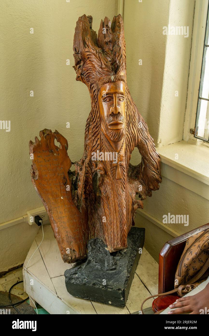 A carved wooden statue in St. John's Anglican Cathedral in Belize City ...