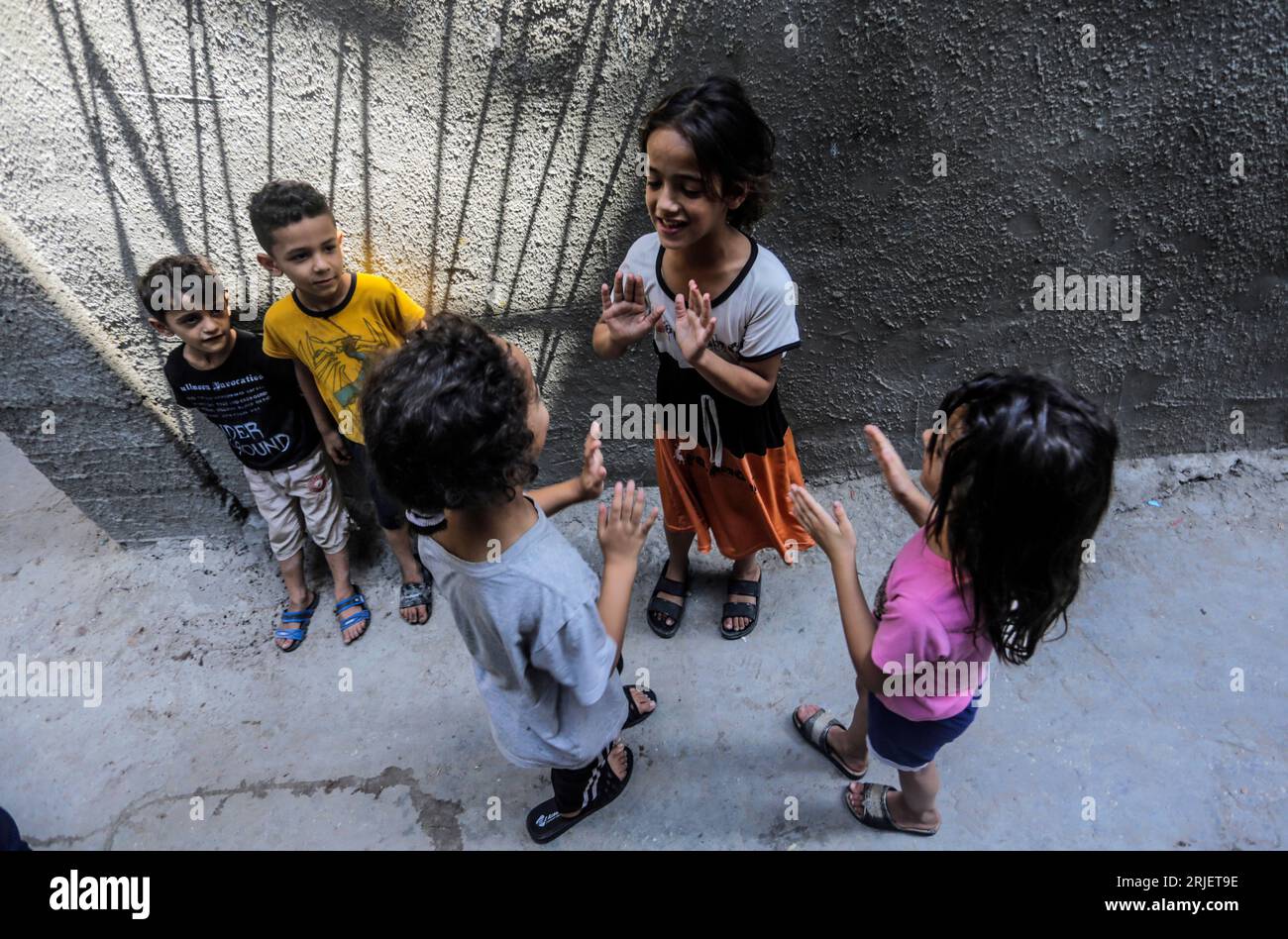 Palestinian children play outside their home in the Shati refugee camp, the third largest camp ...