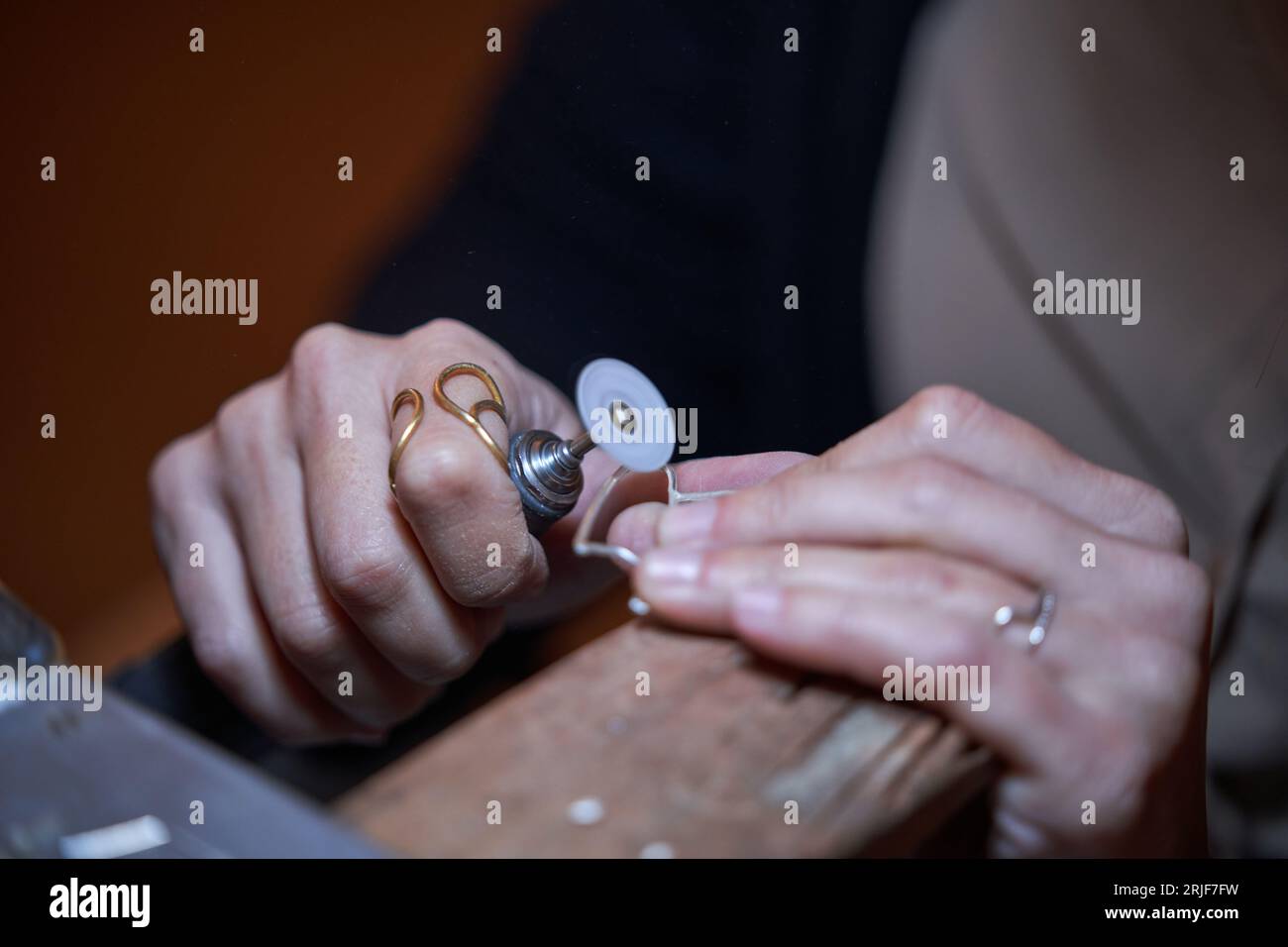 High angle closeup of crop unrecognizable female goldsmith using ...