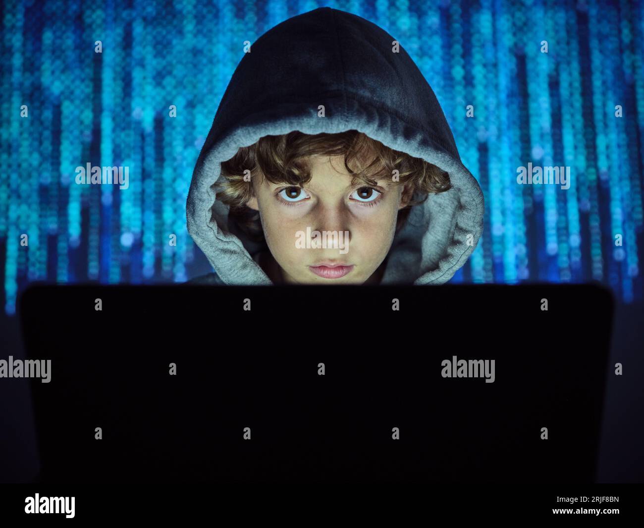 Teenage boy using laptop secret hi-res stock photography and images - Alamy