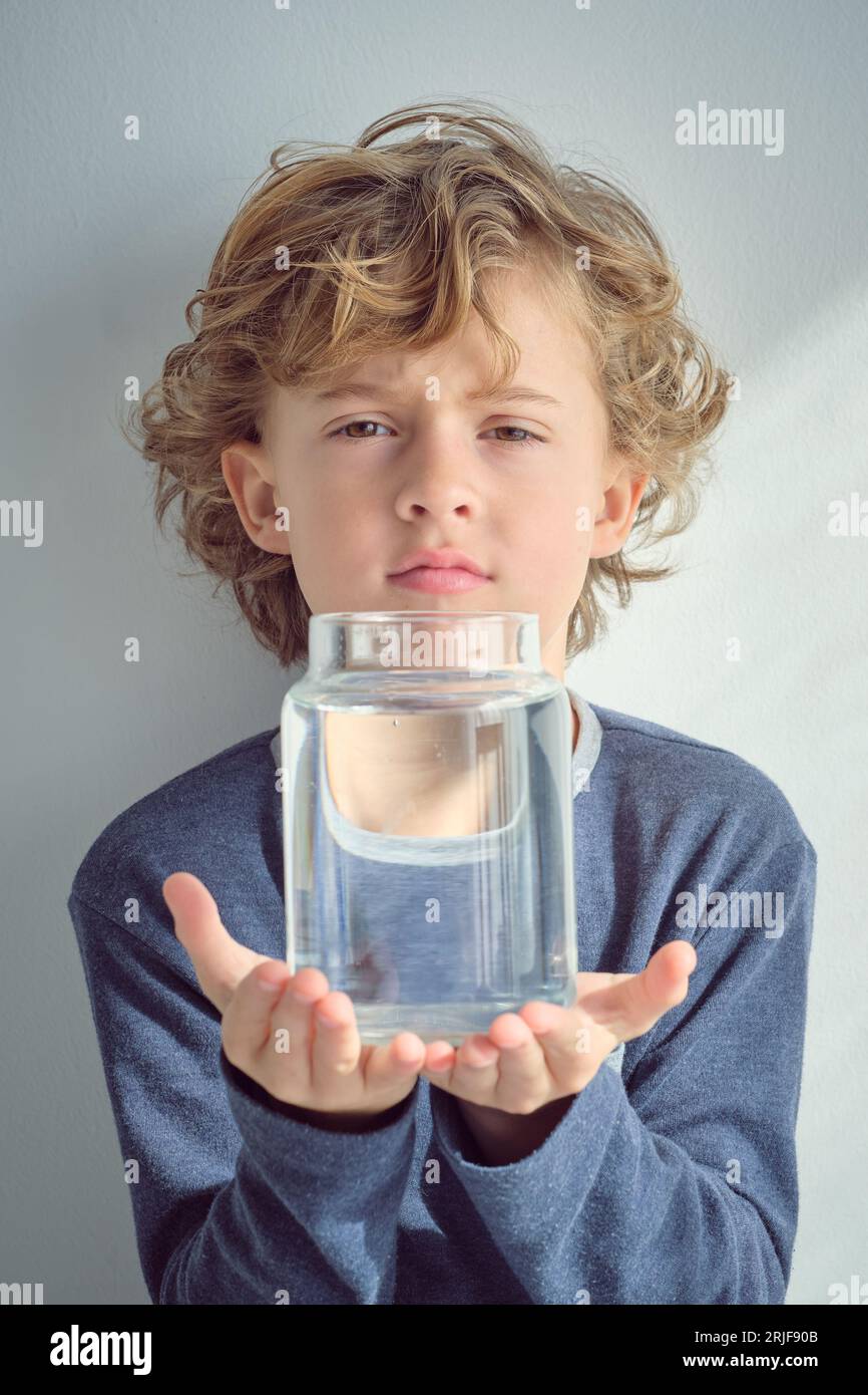 Adorable little kid with curly blond hair and brown eyes wearing blue ...
