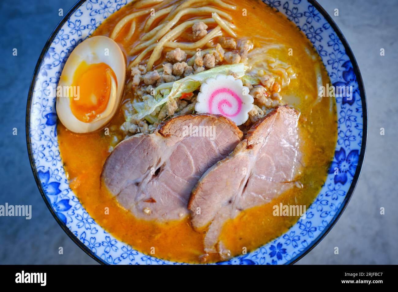 From above of char siu pork in palatable Asian soup with boiled egg and ...