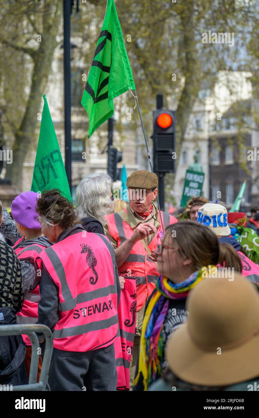 LONDON - April 22, 2023: XR march security: Stewards in action at the ...
