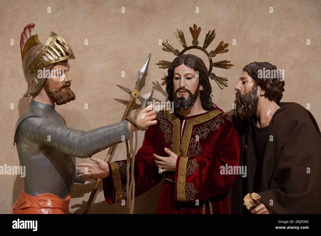 Processional statues representing a Roman soldier preparing Jesus Christ for crucifixion at the ...
