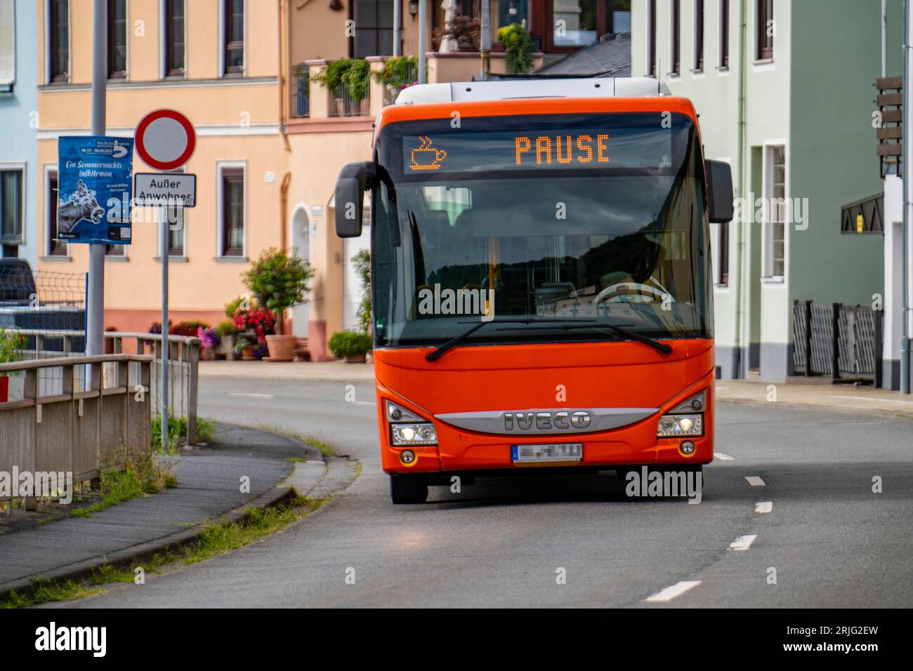 Local bus, city bus, omnibus, drives onto a road, takes a break ...