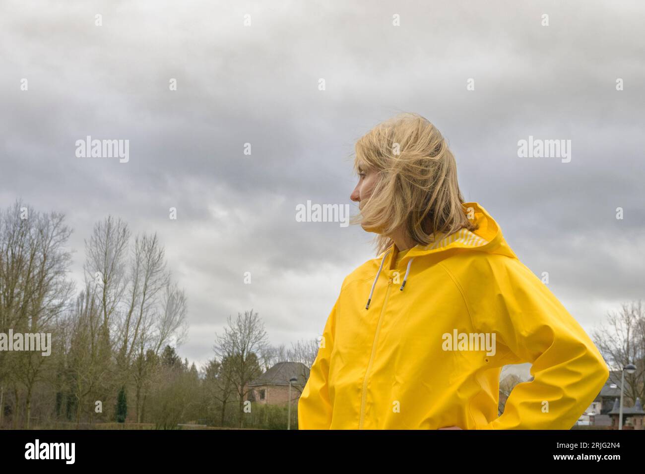 Person in rain coat storm hi-res stock photography and images - Alamy