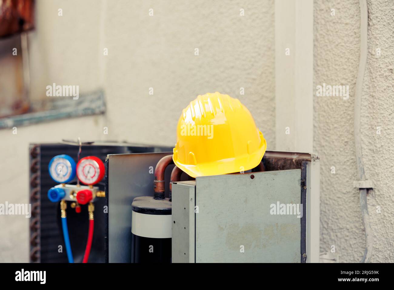 Close up of yellow protection helmet on top of out of service external ...