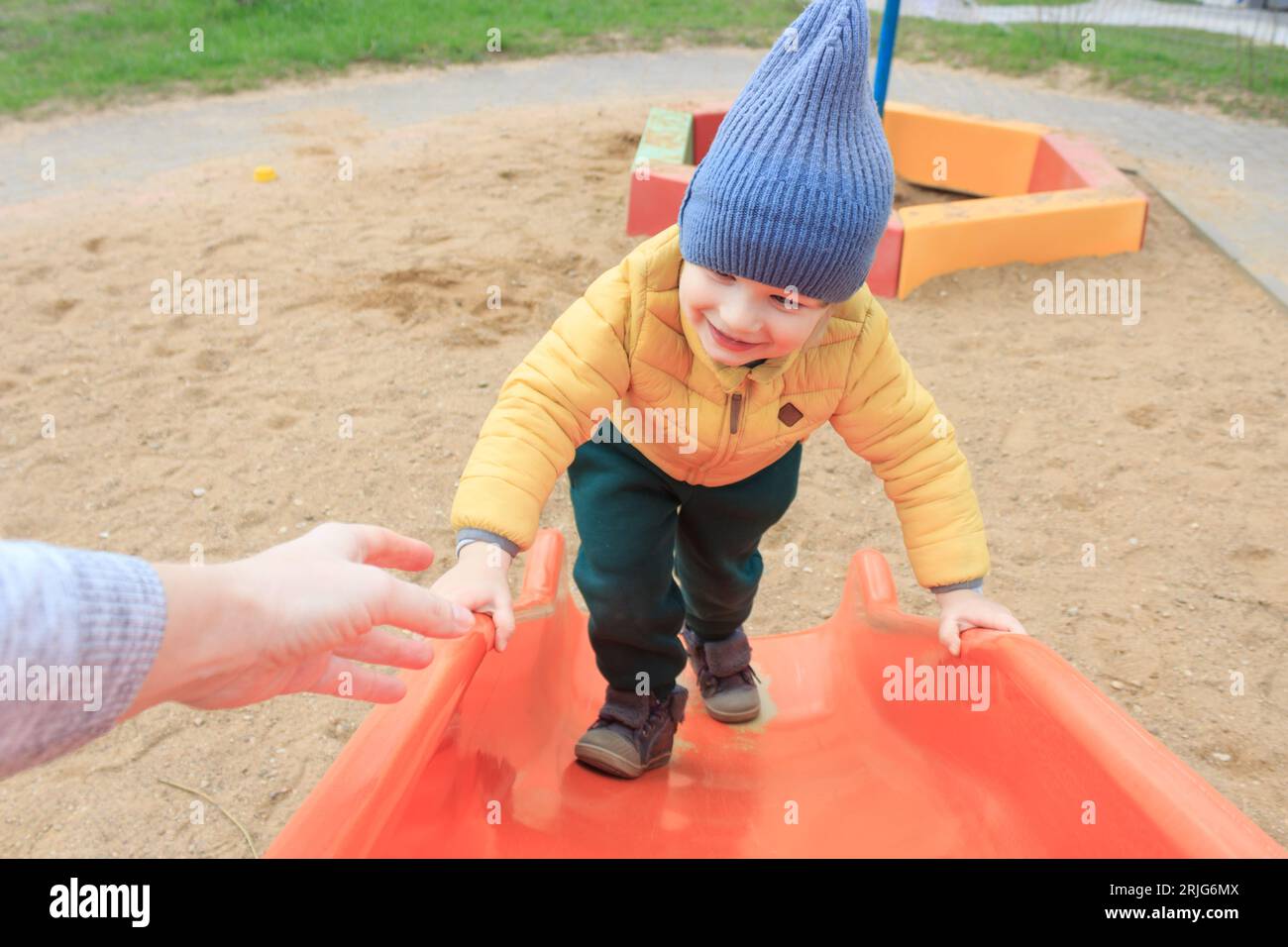 Child climbs hi-res stock photography and images - Alamy