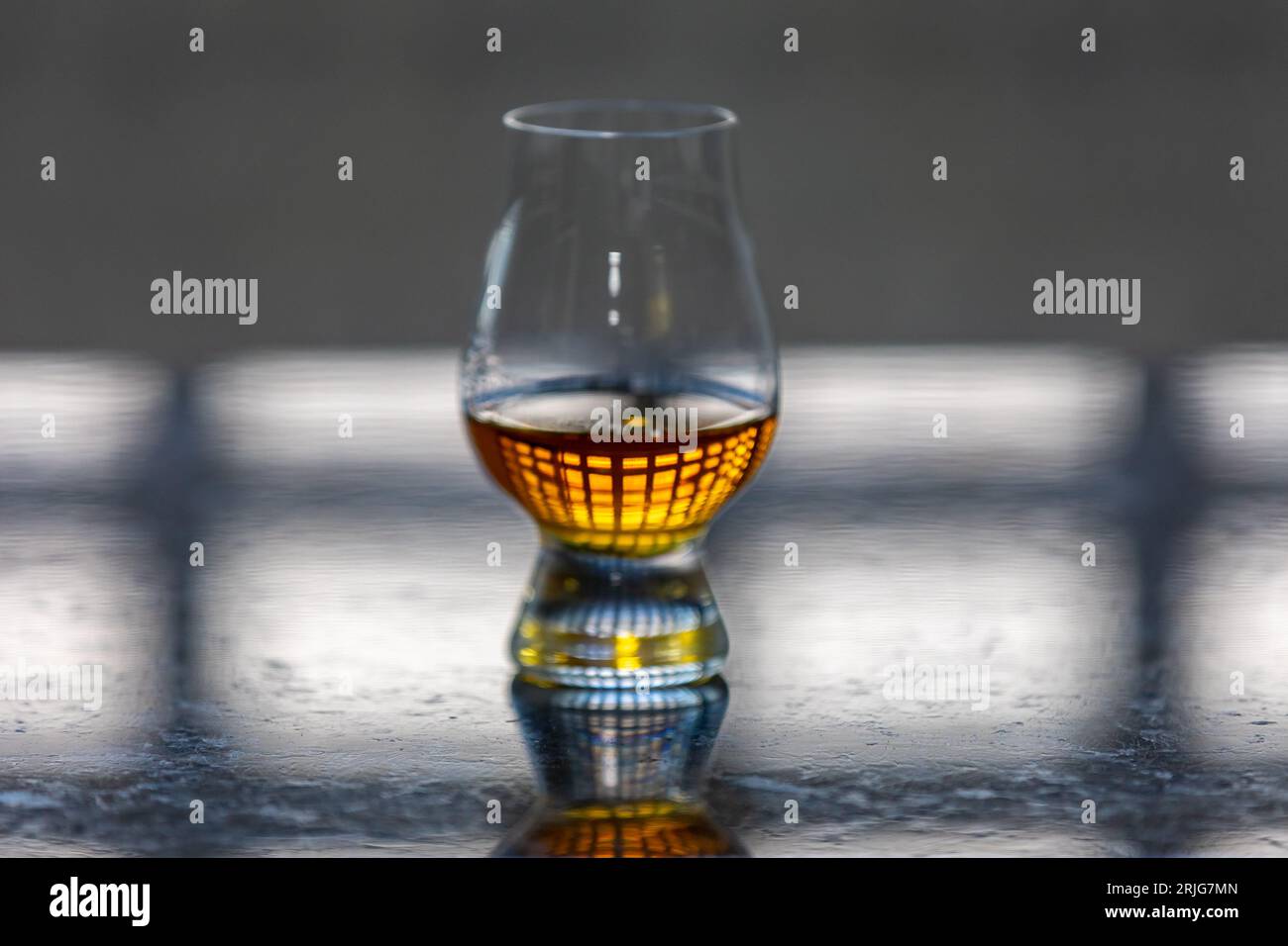 Single malt scotch whiskey in glencairn tasting glass with window ...