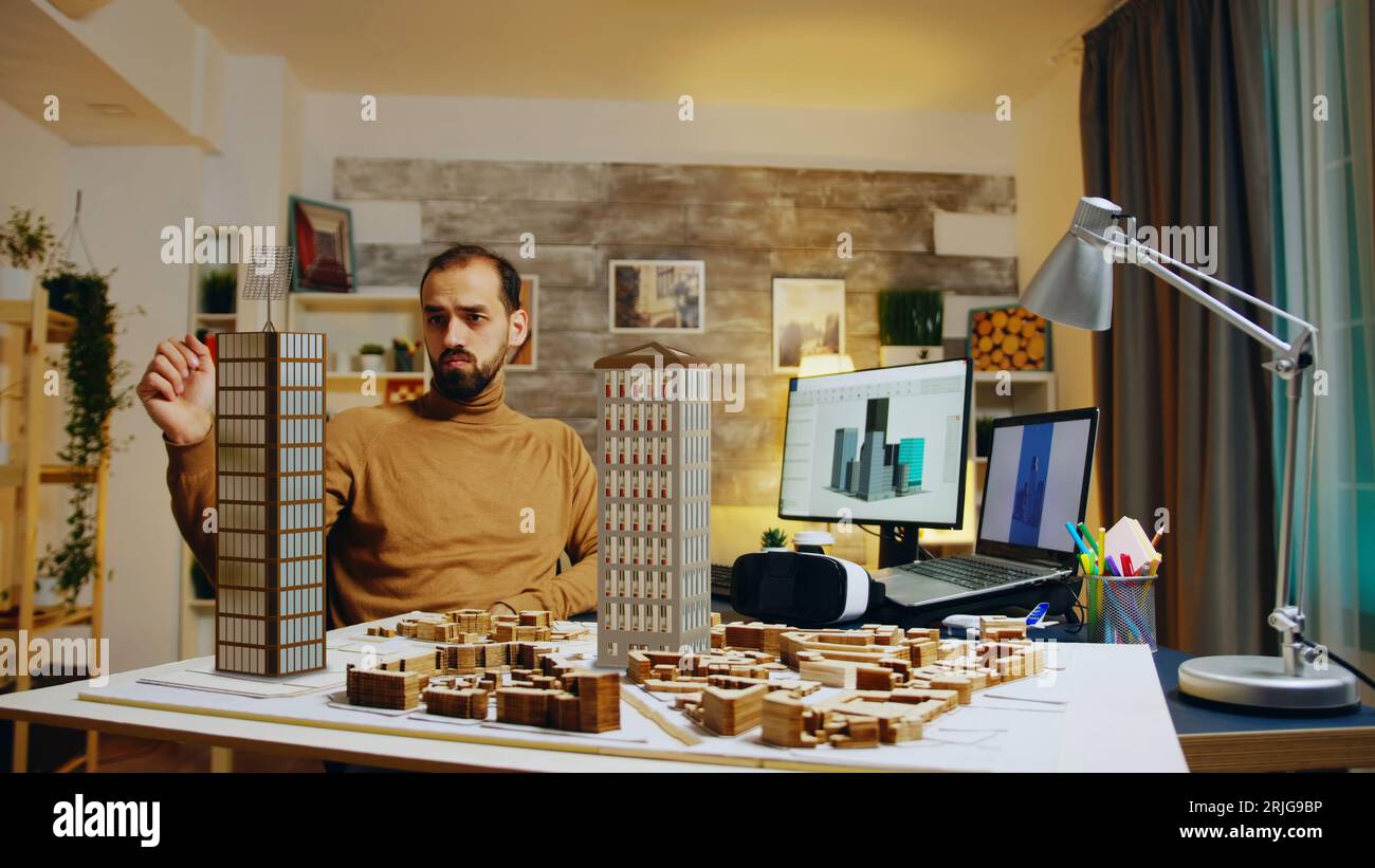 Construction developer working in office on creation of new residential ...