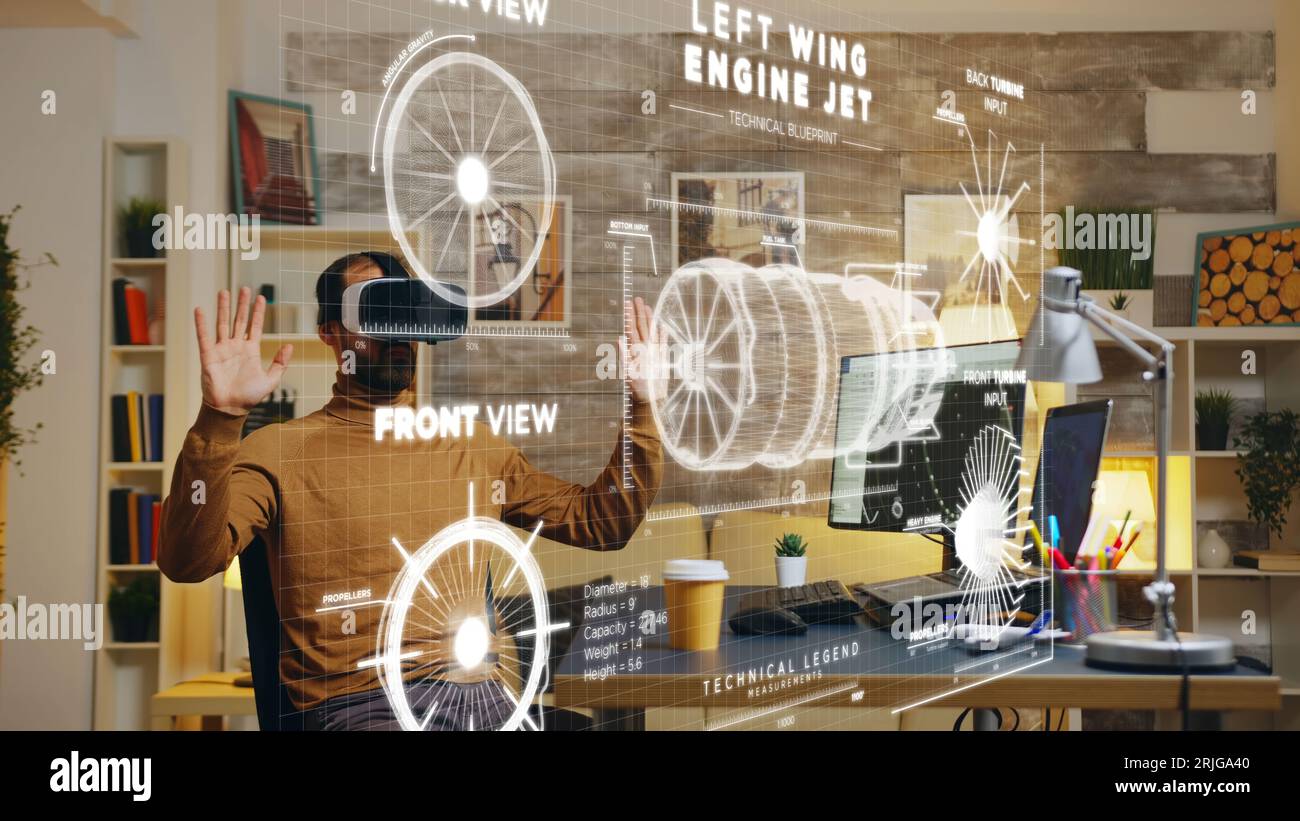 Freelancer at home wearing VR goggles using augmented reality to visualize final result after ...