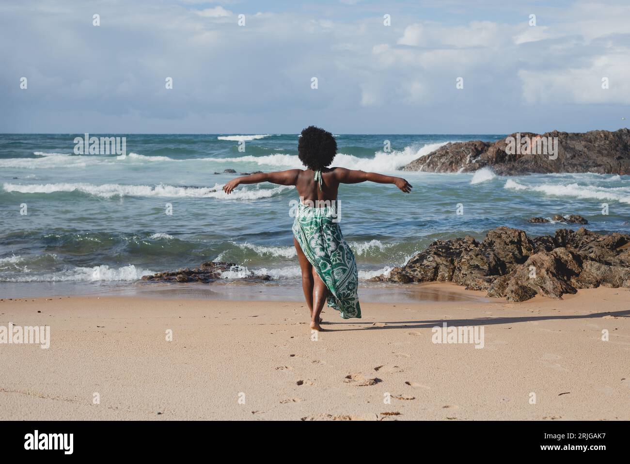 Full length portrait of a beautiful woman with black power hair ...