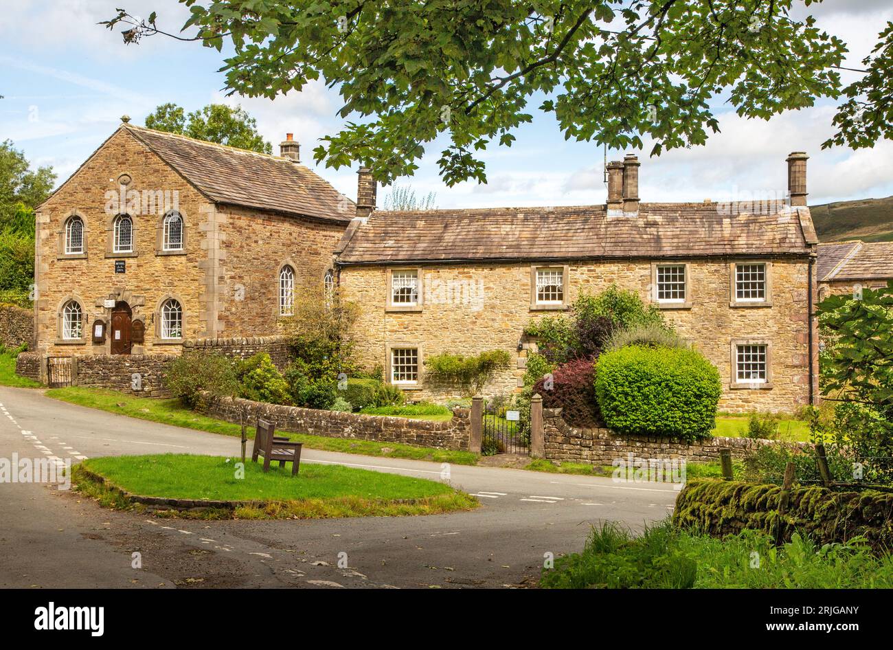 View Of The Old Methodist Chapel And Village Green With A Bench In The View Of The Old Methodist Chapel And Village Green With A Bench In The
