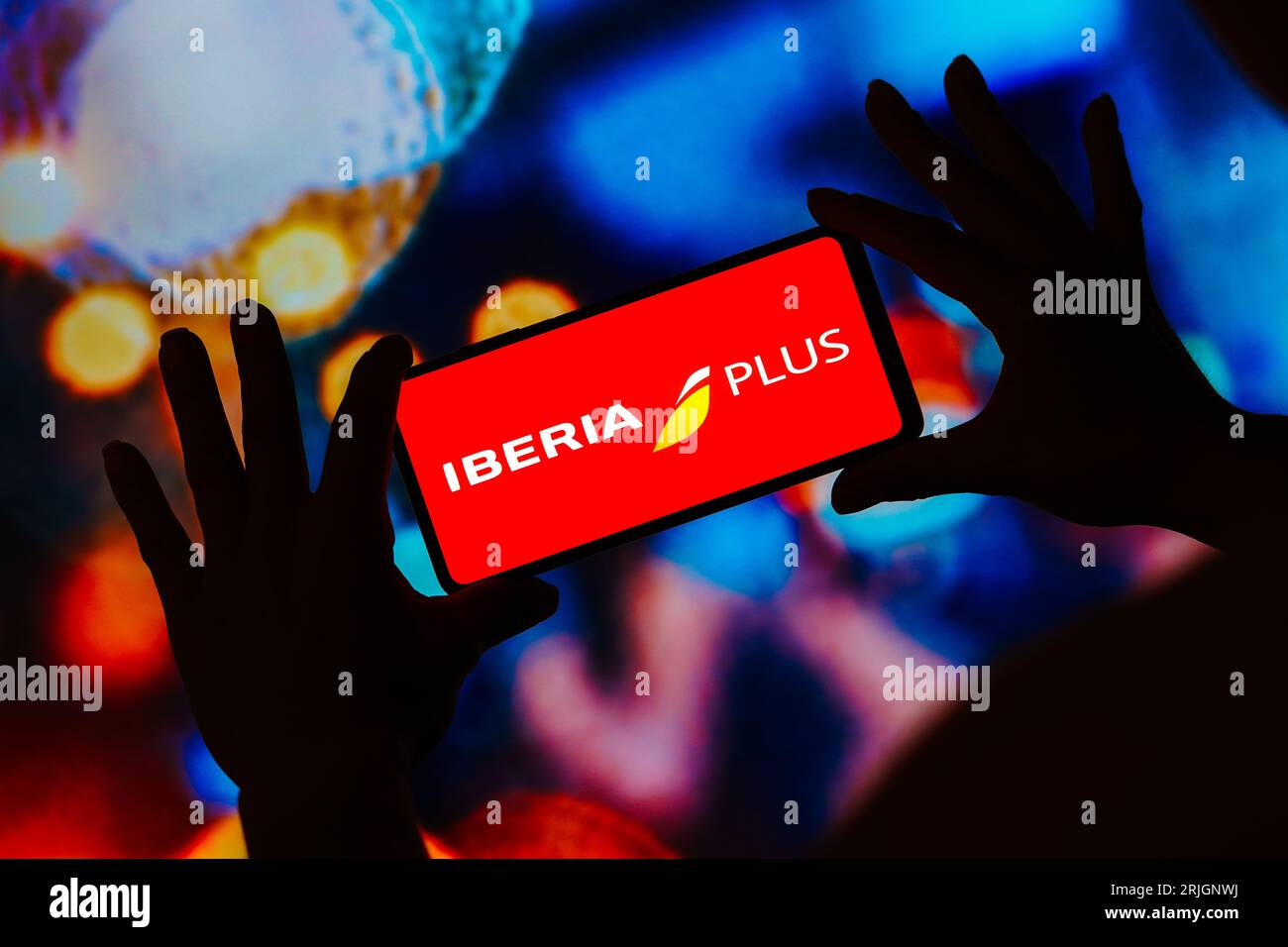 In this photo illustration, the Iberia Plus logo seen displayed on a ...