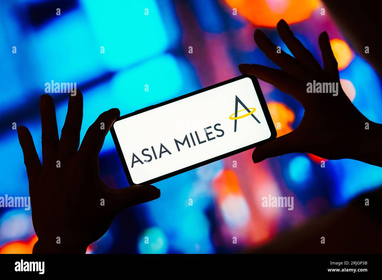 In this photo illustration, the Asia Miles (Cathay Pacific) logo seen ...