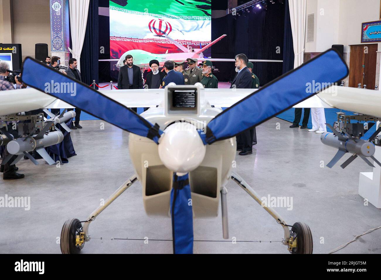 Tehran, Iran. 23rd Aug, 2023. Iranian President EBRAHIM RAISI (C) visiting an exhibit during a ...