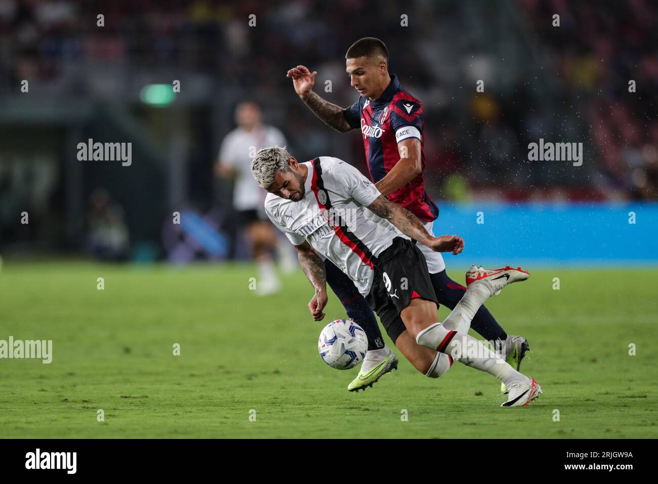 Theo Hernandez of AC Milan (L) and Nicolas Dominguez of Bologna (R) in ...