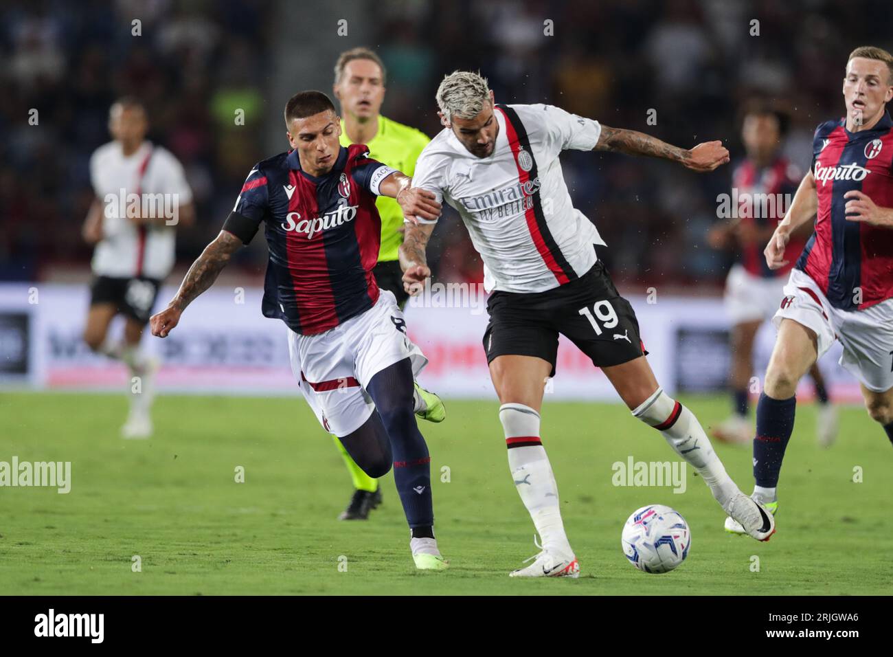 Theo Hernandez of AC Milan (L) and Nicolas Dominguez of Bologna (R) in ...