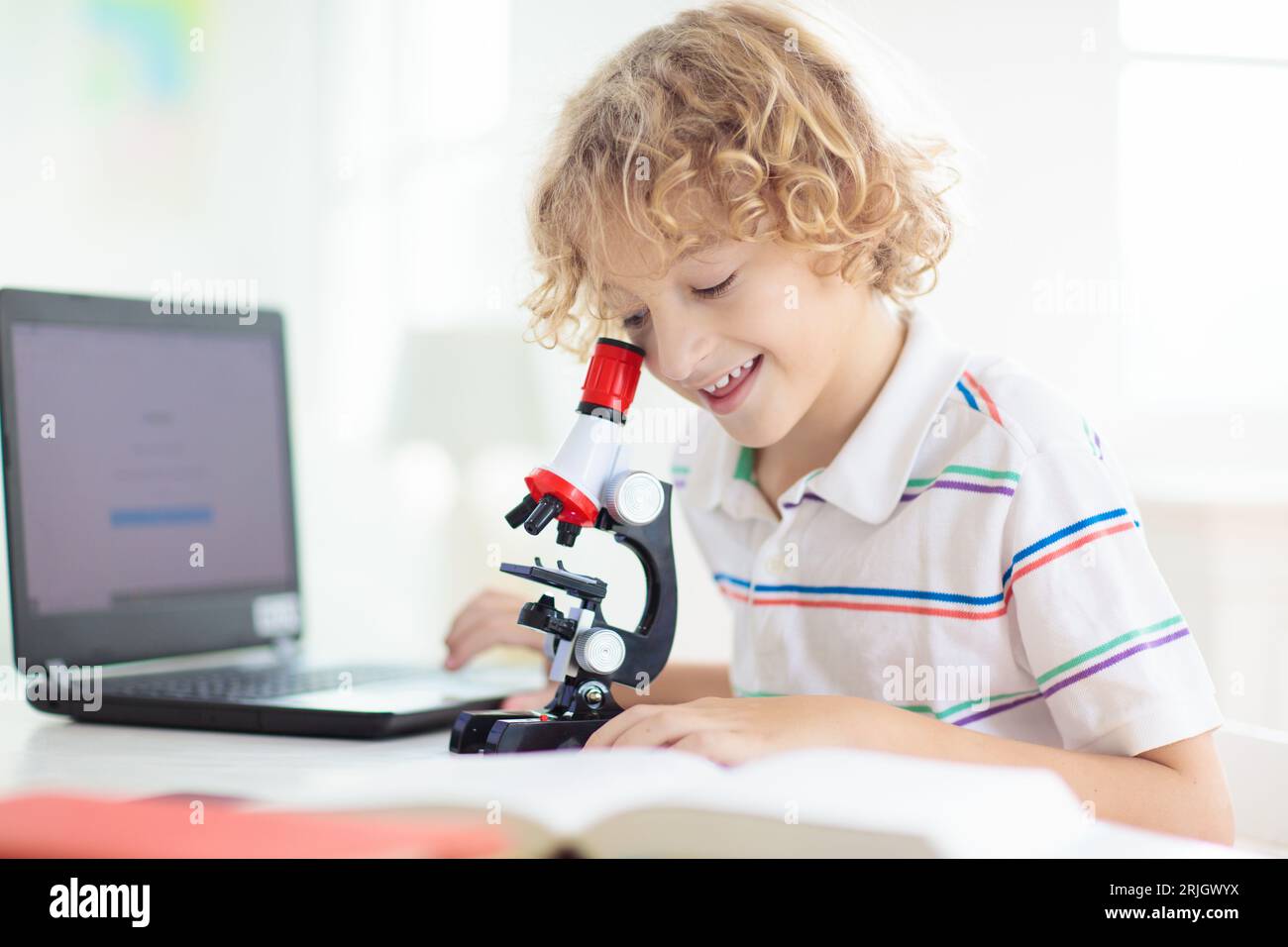 School kids with microscope. Science class. Children making biology or ...