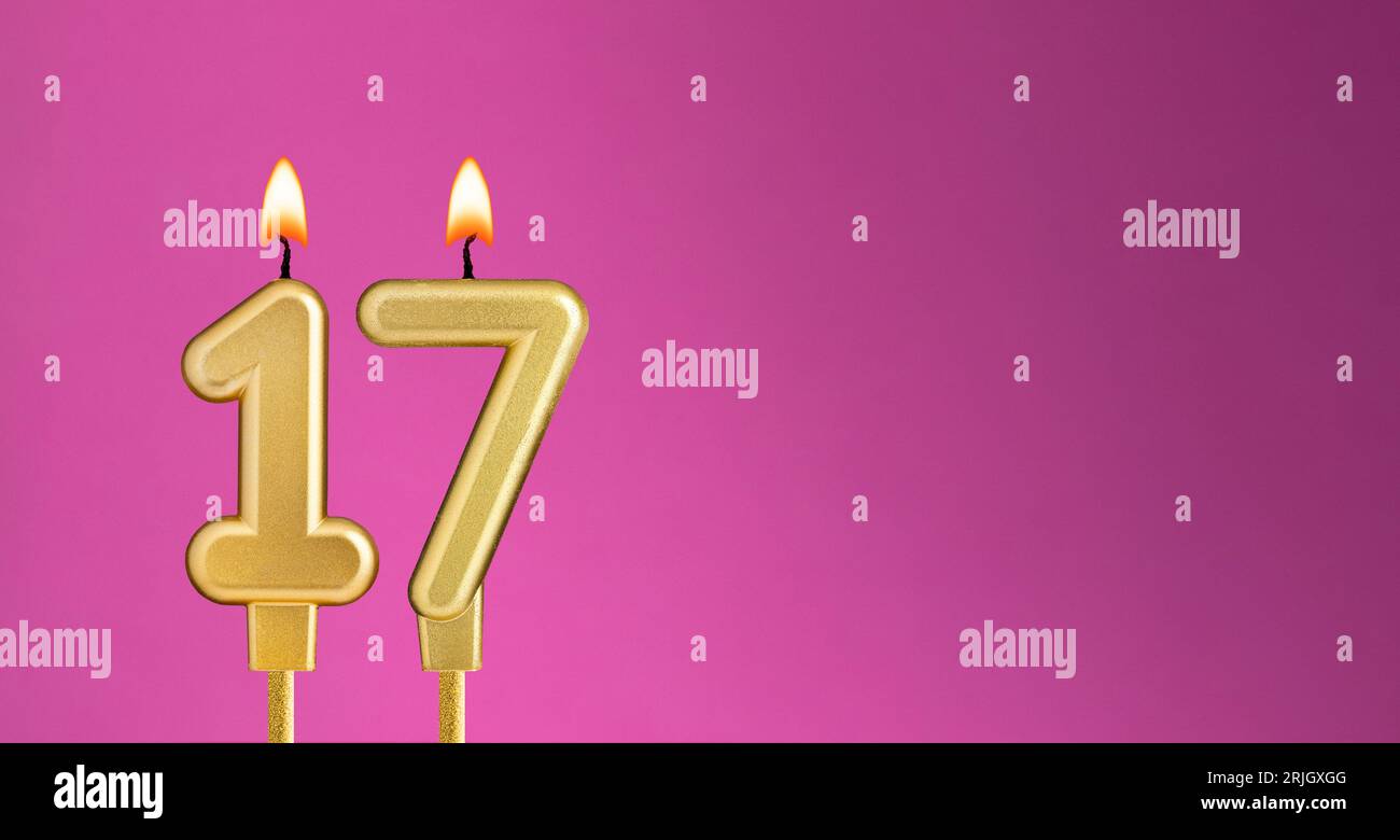 Candle number 17 in purple background - birthday card Stock Photo - Alamy