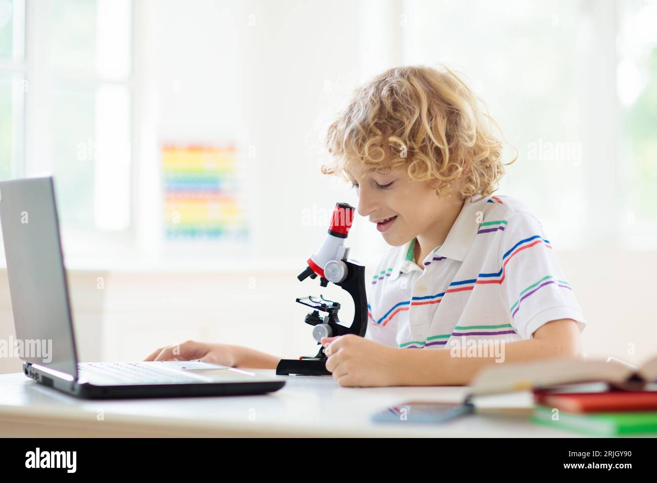 School kids with microscope. Science class. Children making biology or ...