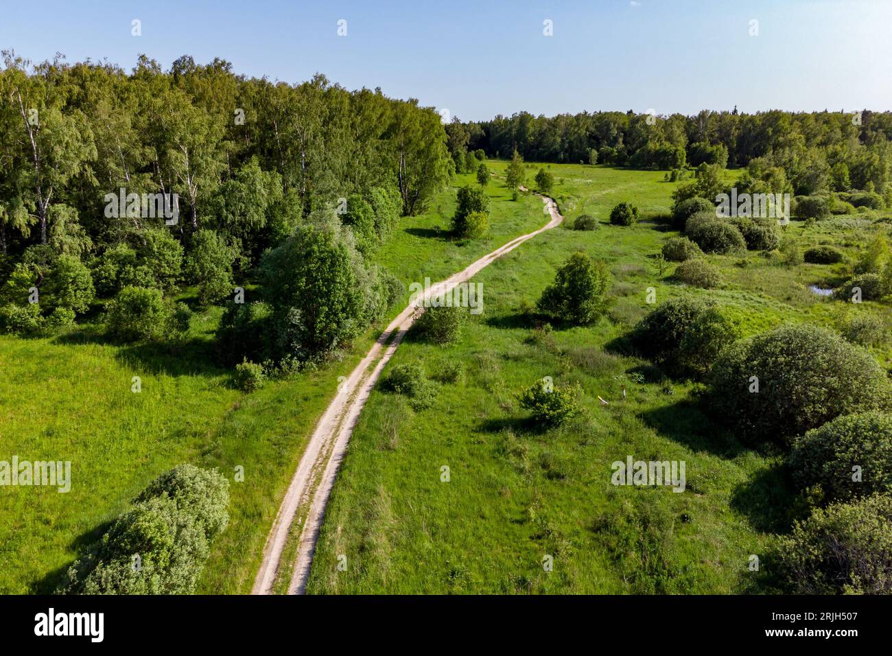 Aerial flight above dirt road hi-res stock photography and images - Alamy