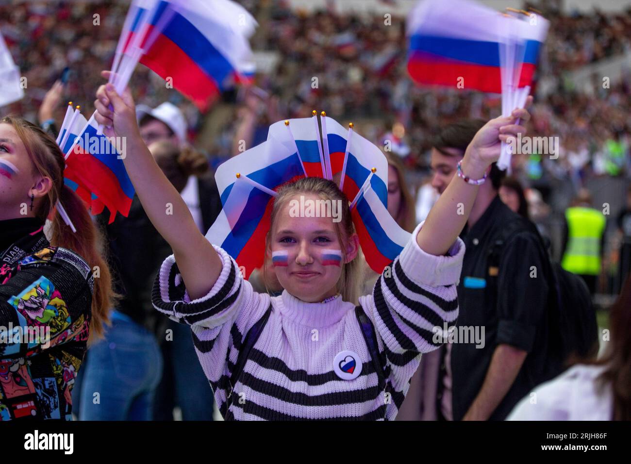 Moscow, Russia. 22nd of August, 2023 People hold Russian flags as they ...