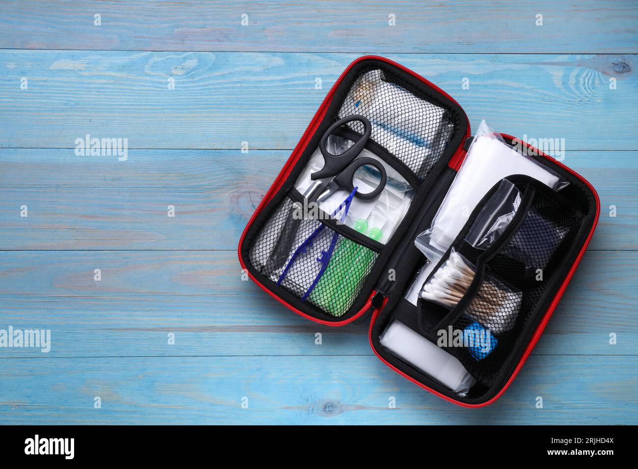 First aid kit on blue wooden table, top view. Space for text Stock ...