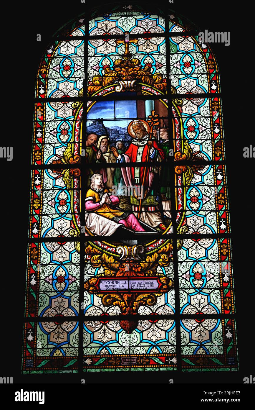 Stained glass window depicting Christian themes in Saint Cornely church ...