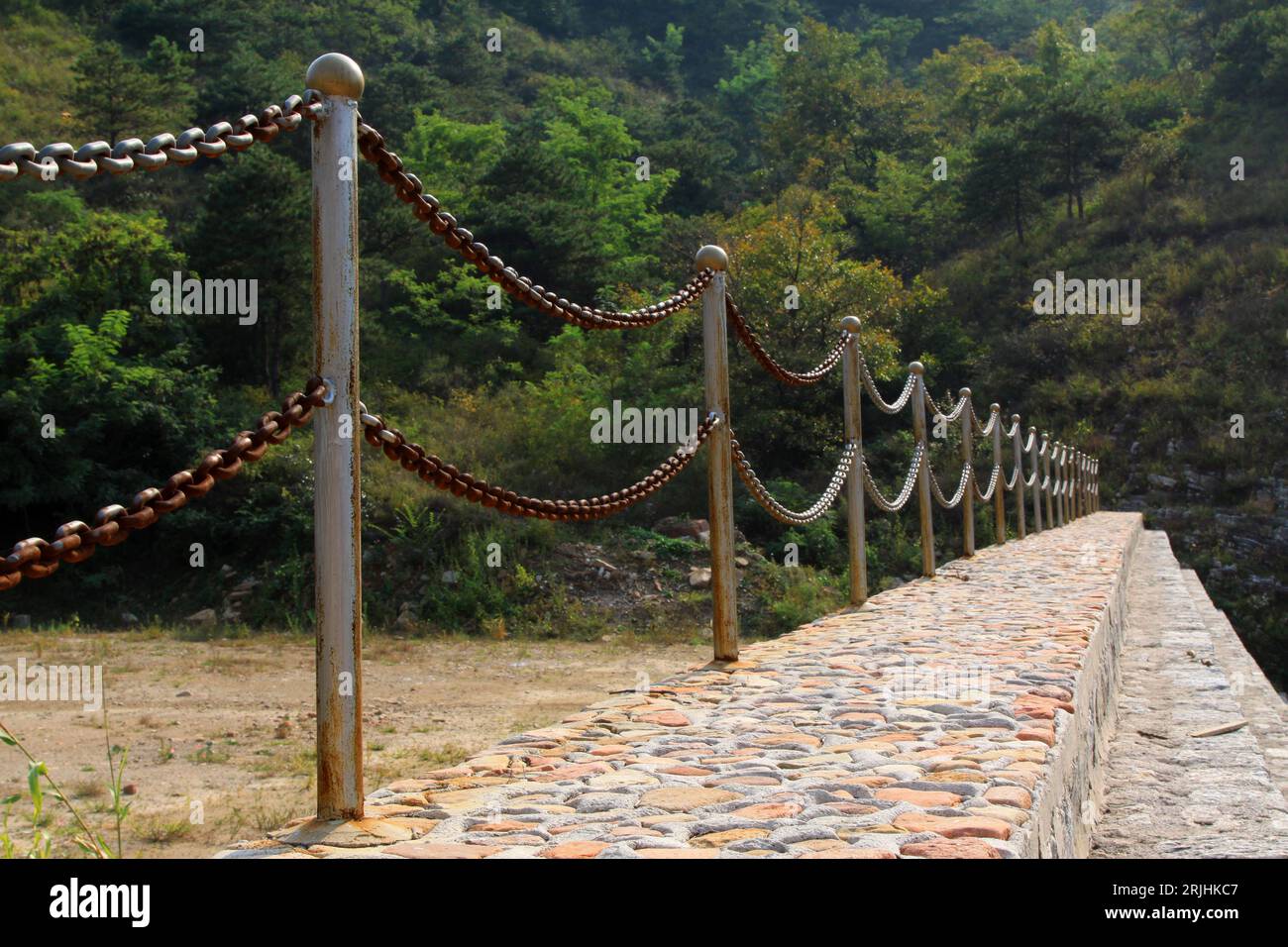 stone ground and iron chain in a park Stock Photo - Alamy
