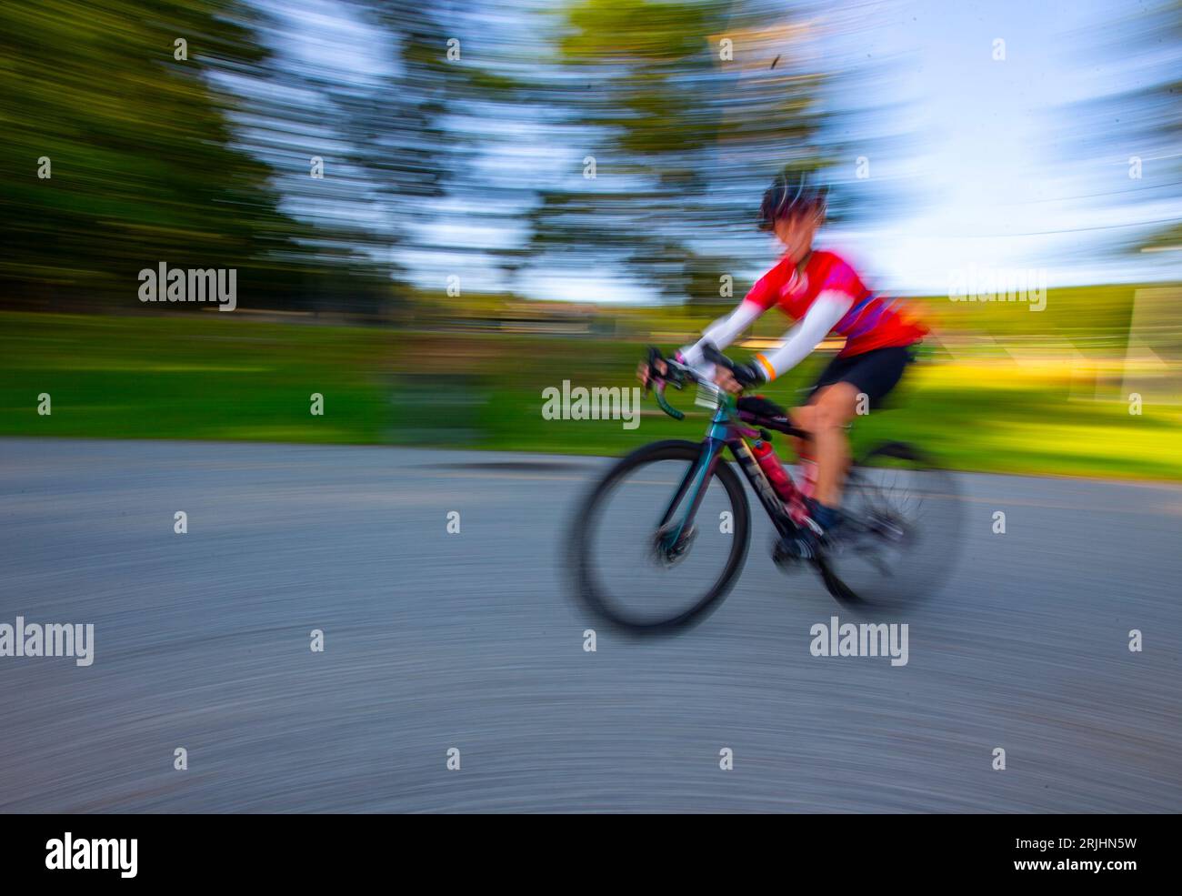 A female cyclist riding in a bike rally Stock Photo - Alamy