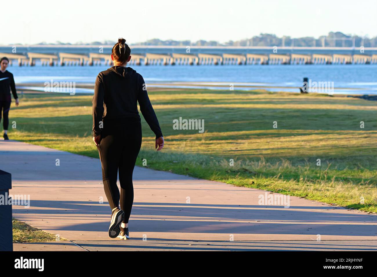 Random people walking away from the camera. No faces, sports, healthy ...