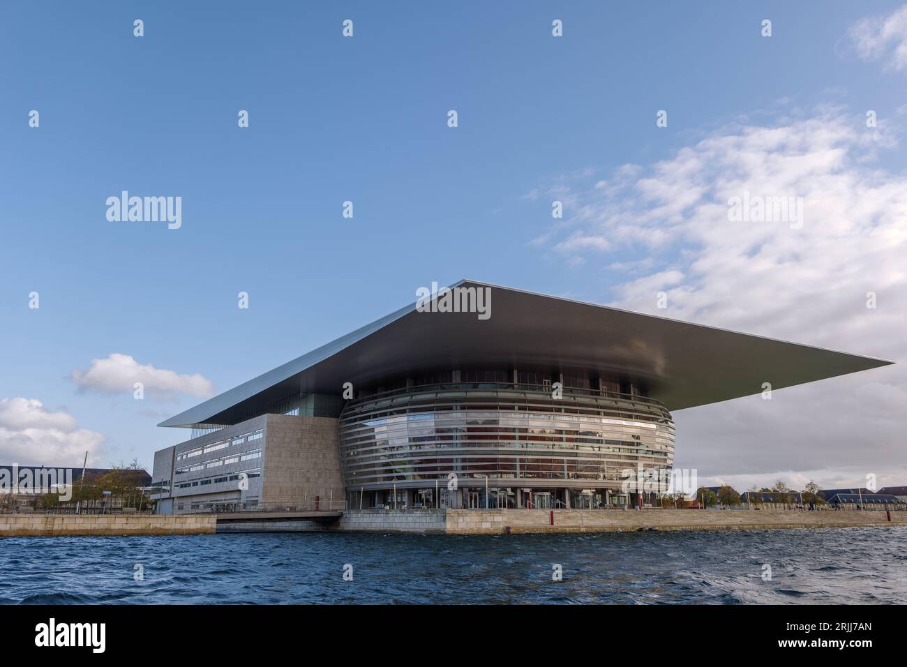 Outdoor exterior view of Copenhagen Opera House from boat tour on water ...