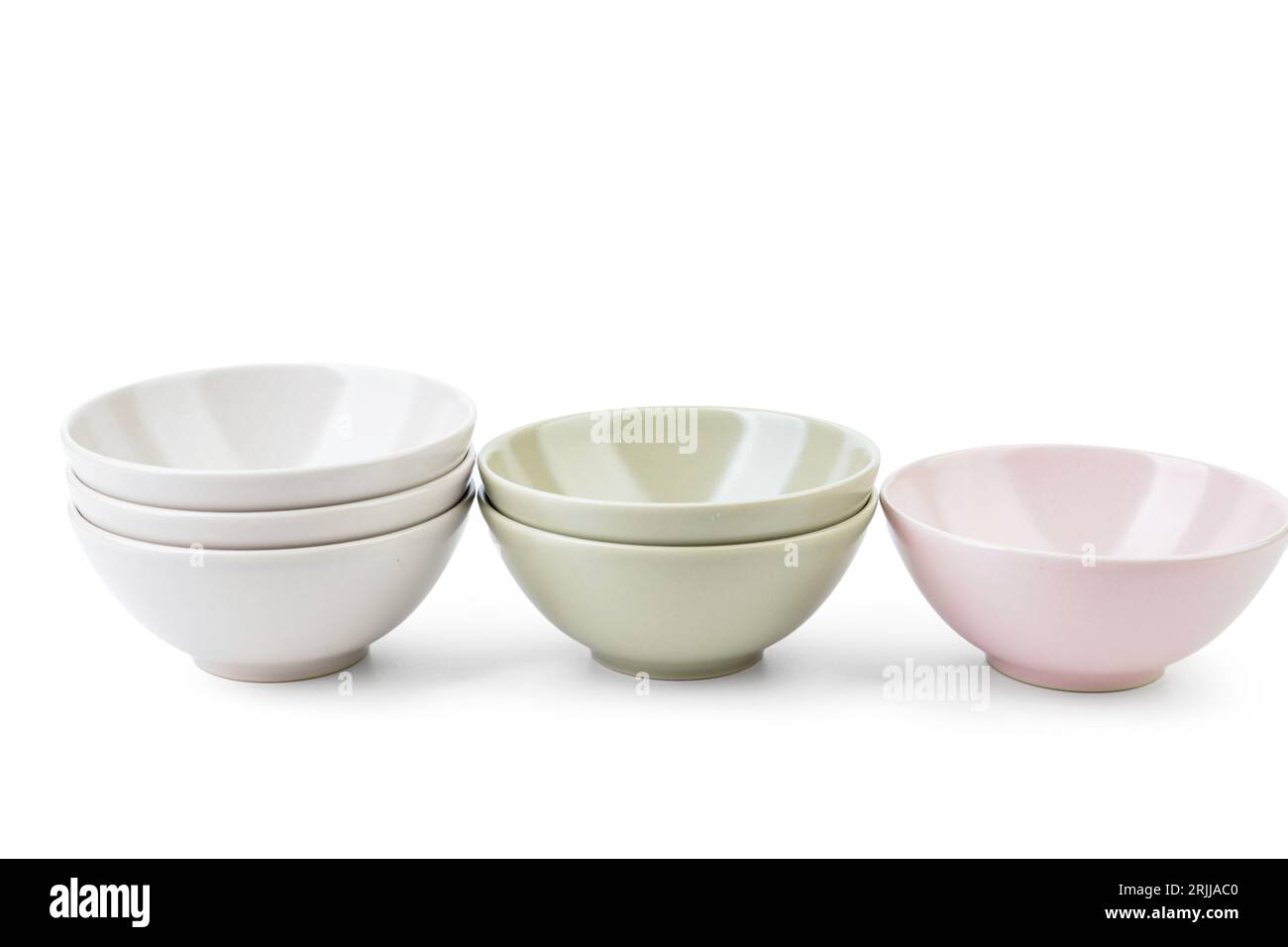 Set of color bowls on white background Stock Photo - Alamy