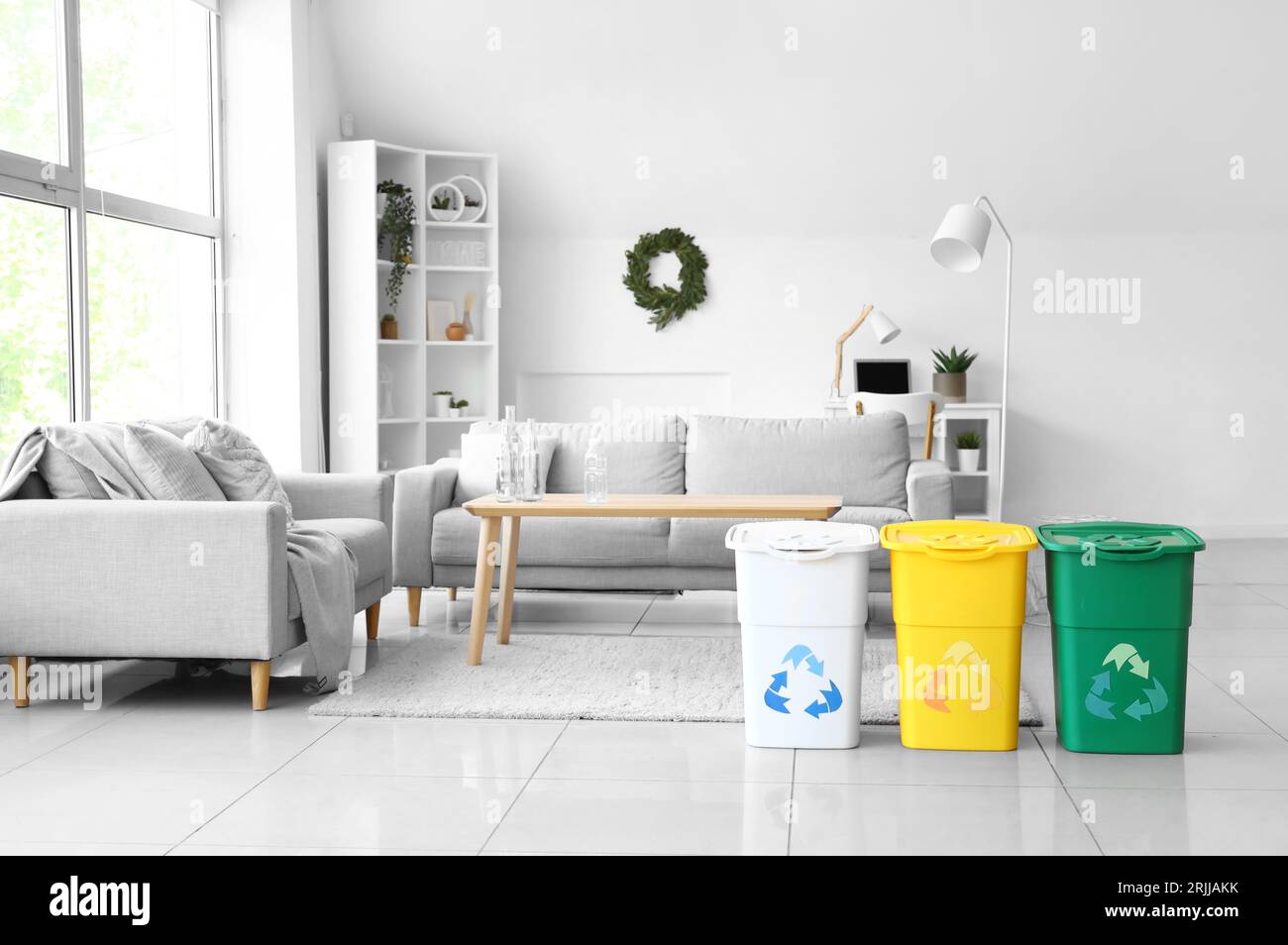 Recycle trash bins in living room Stock Photo - Alamy