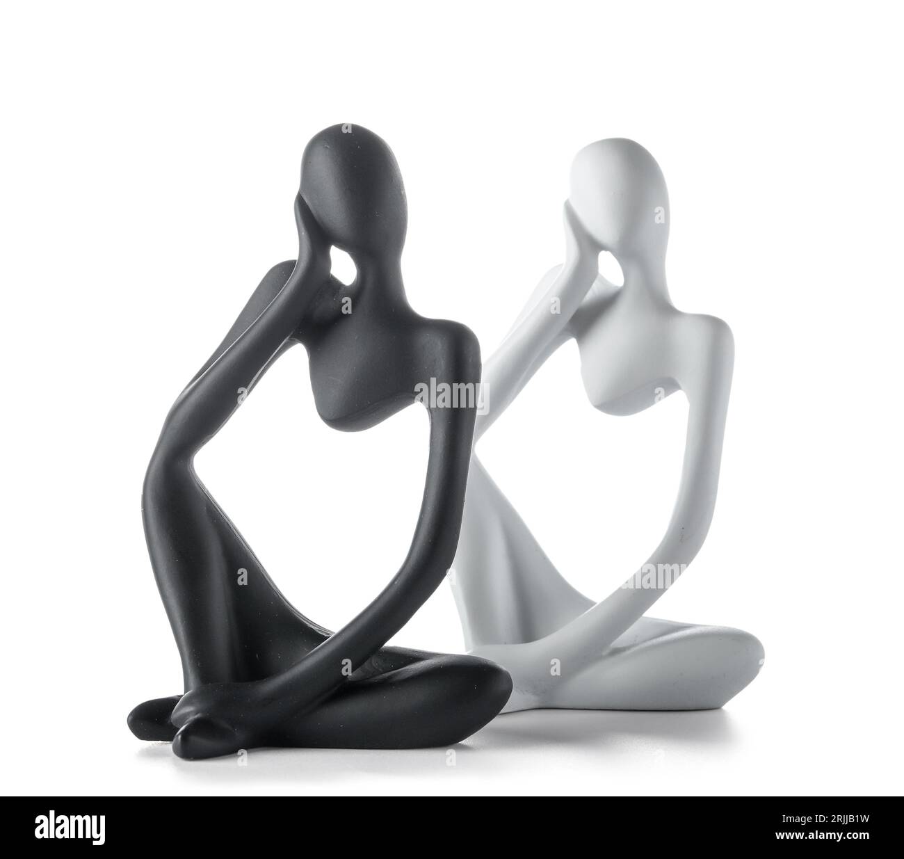 Statuettes in form of woman body on white background Stock Photo - Alamy