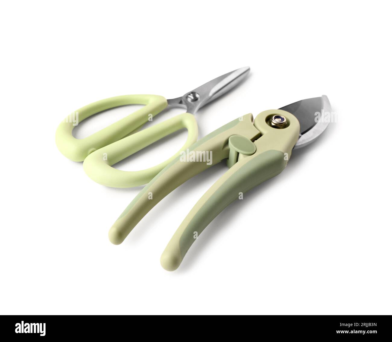 Floral scissors and secateurs with green handle on white background ...