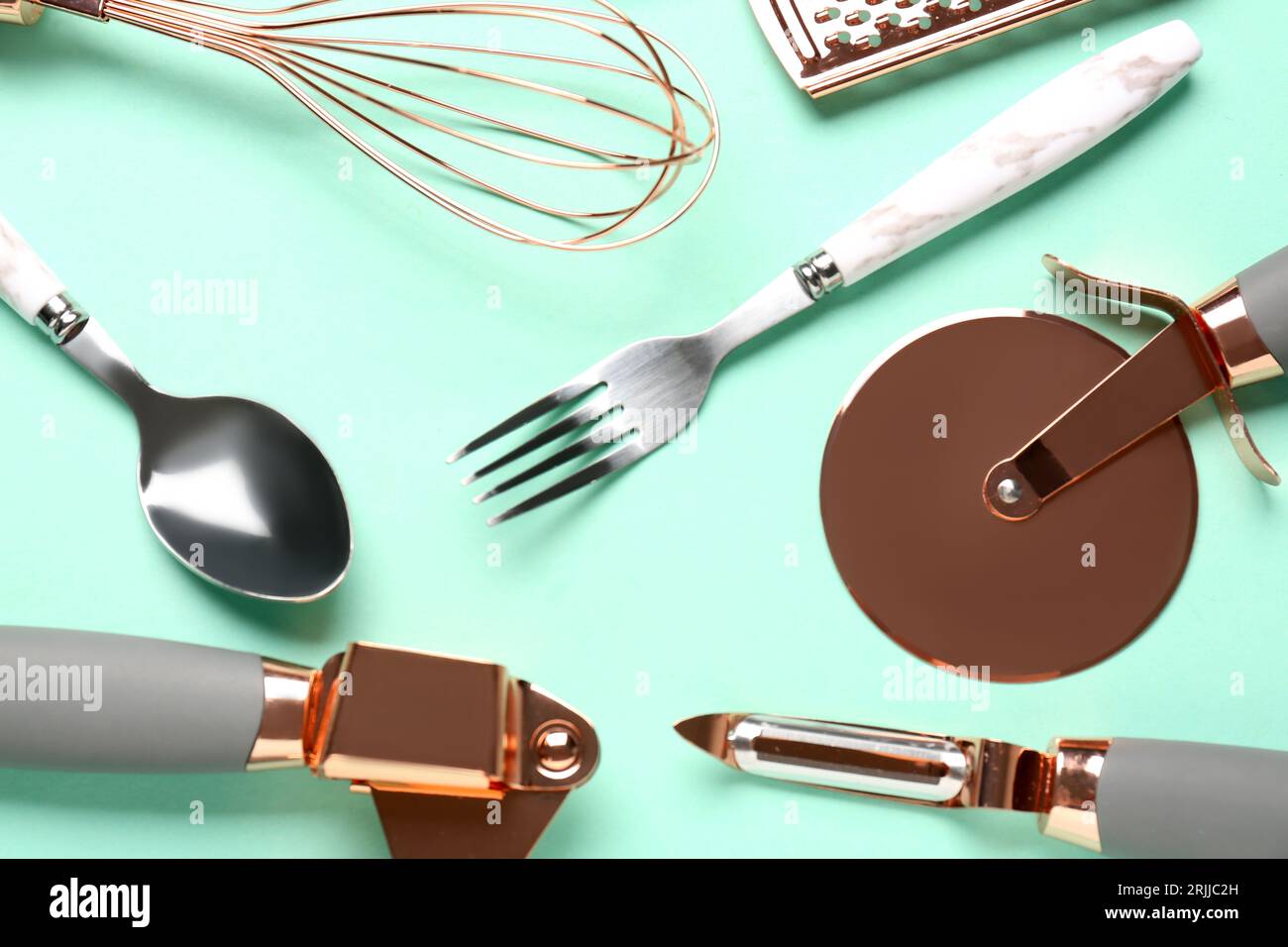 Set of kitchen utensils on turquoise background Stock Photo - Alamy
