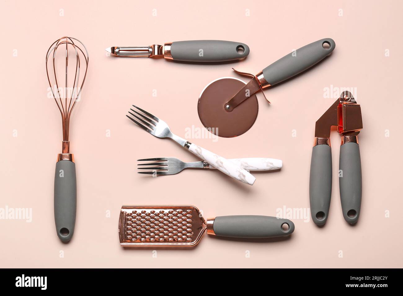 Set of different kitchen utensils on beige background Stock Photo - Alamy