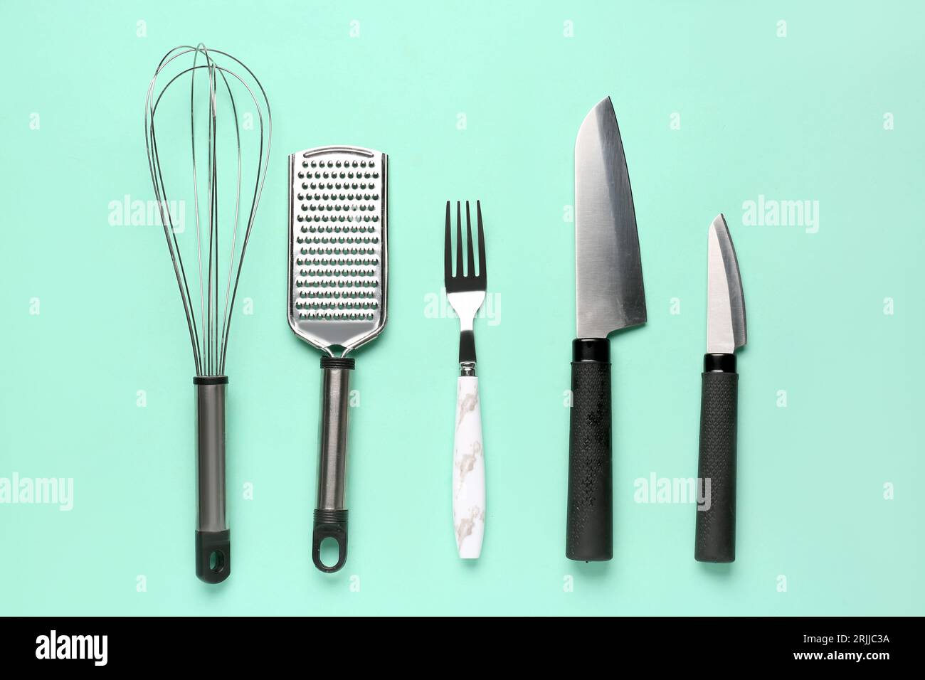 Set of kitchen utensils on turquoise background Stock Photo - Alamy