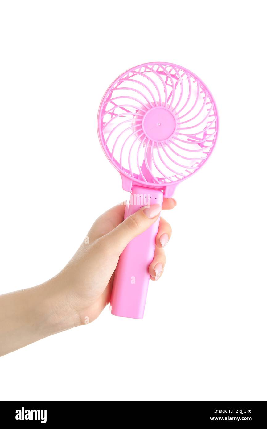Female hand with small pink electric fan on white background Stock ...