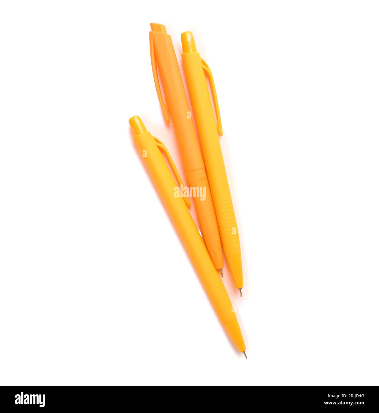 Orange pens on white background Stock Photo - Alamy