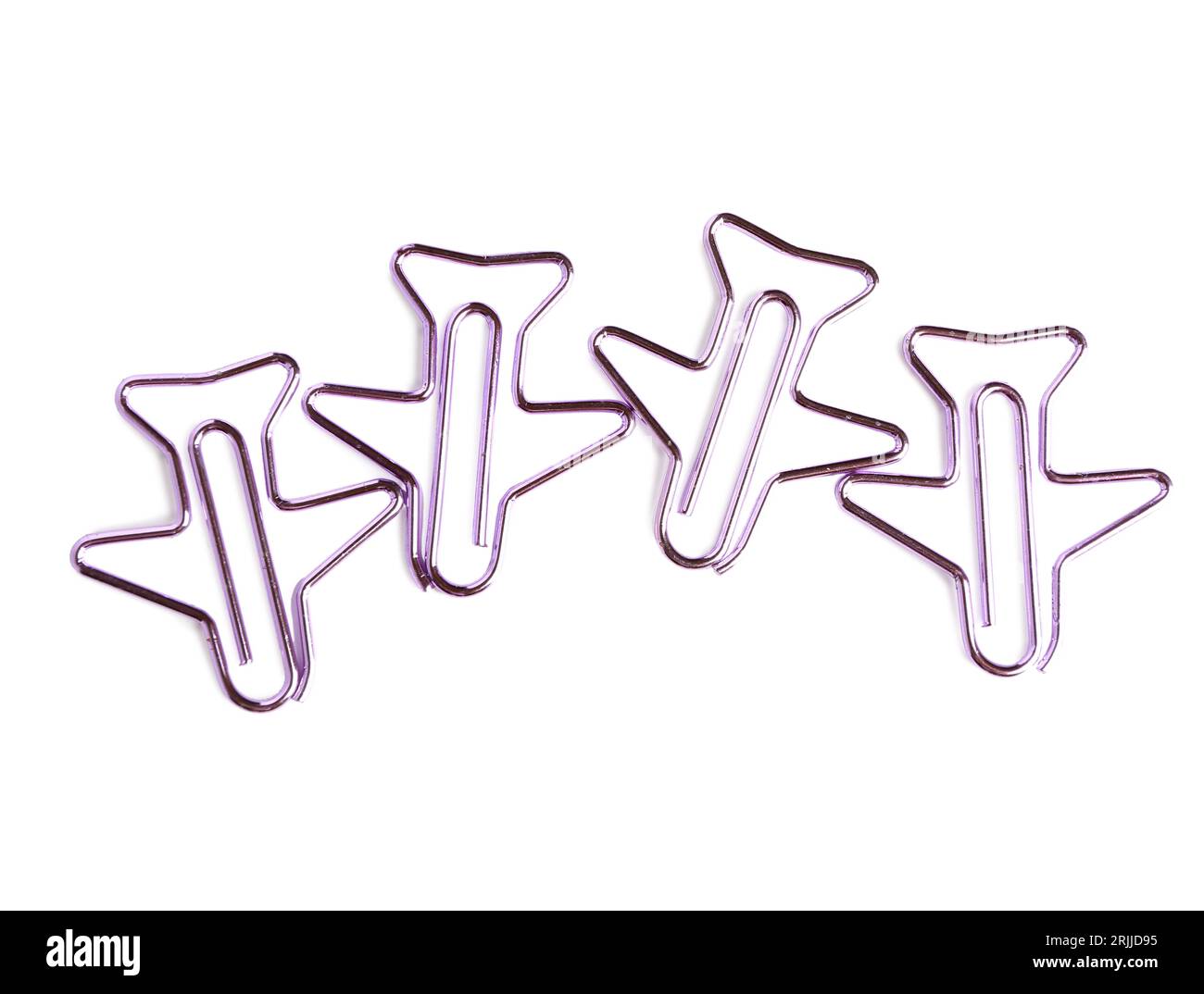 Purple paper clips in shape of airplanes on white background Stock ...