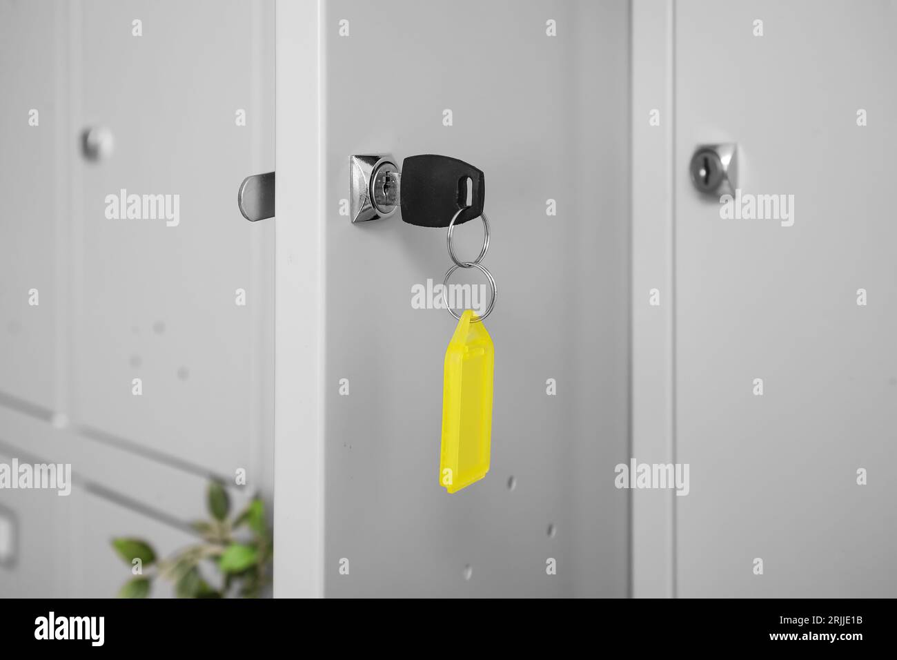 Modern locker with key, closeup Stock Photo - Alamy