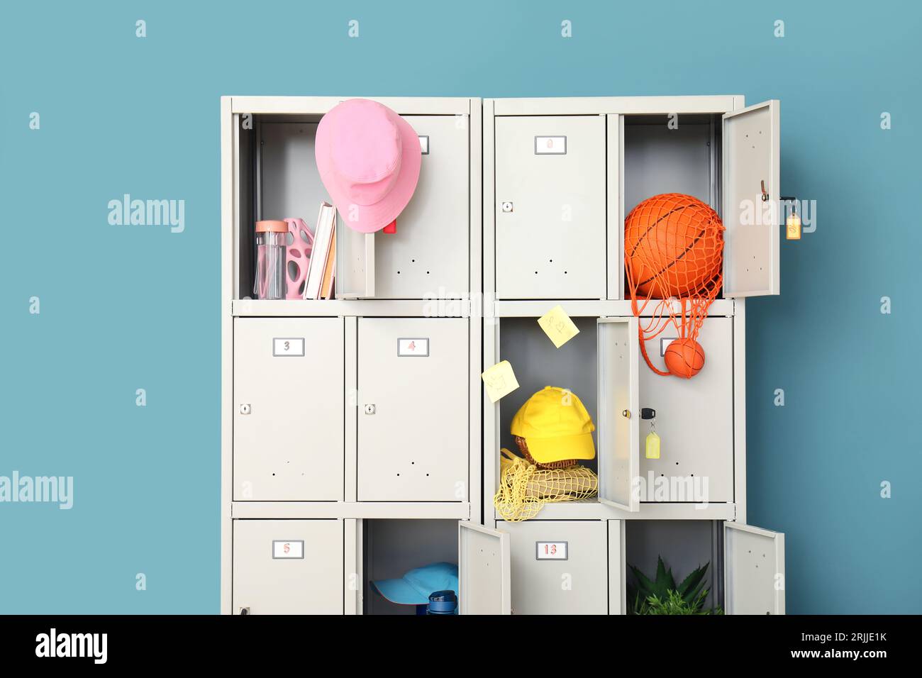Modern locker with things near blue wall Stock Photo - Alamy