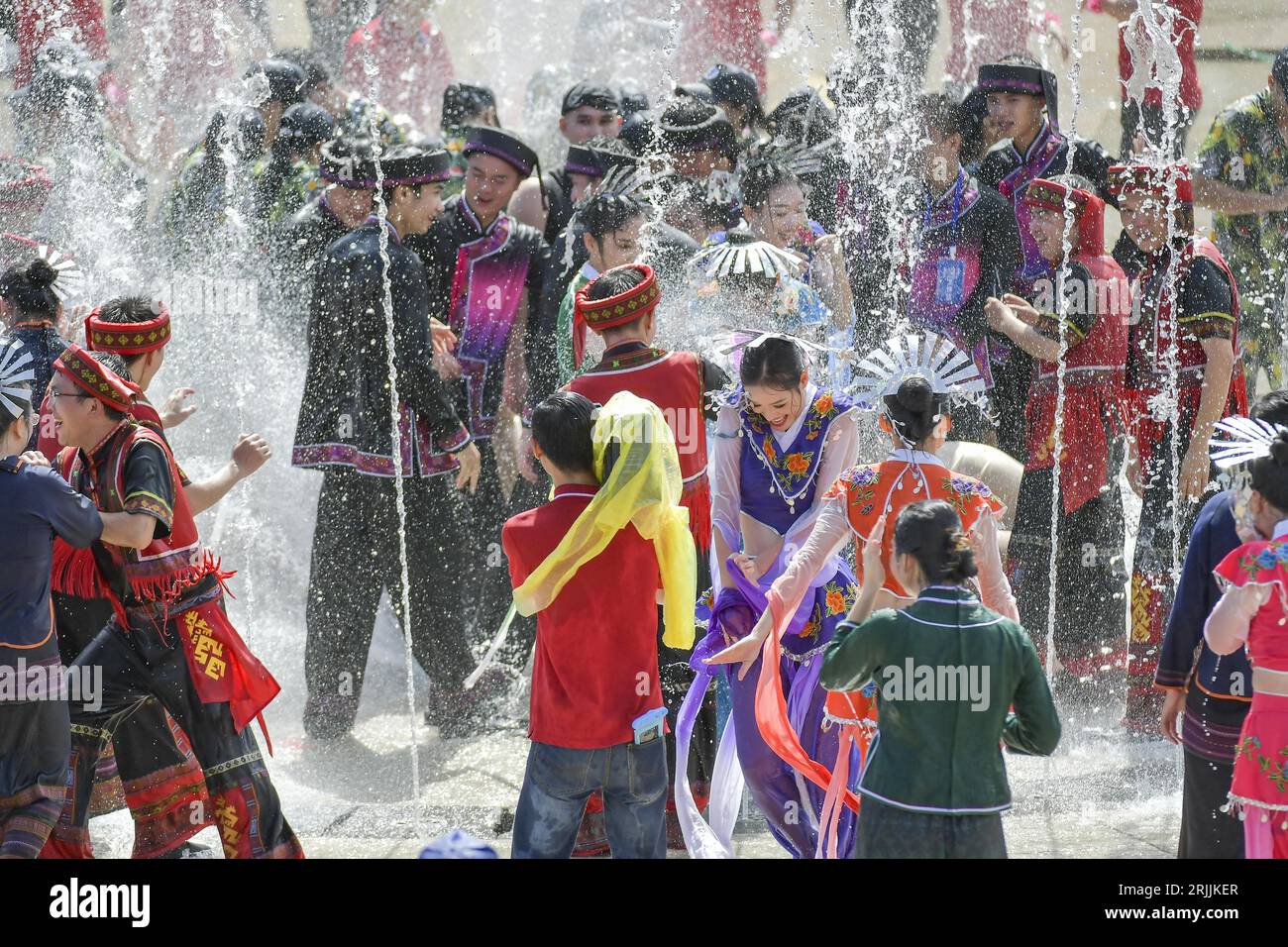 **CHINESE MAINLAND, HONG KONG, MACAU AND TAIWAN OUT** People splash hot ...