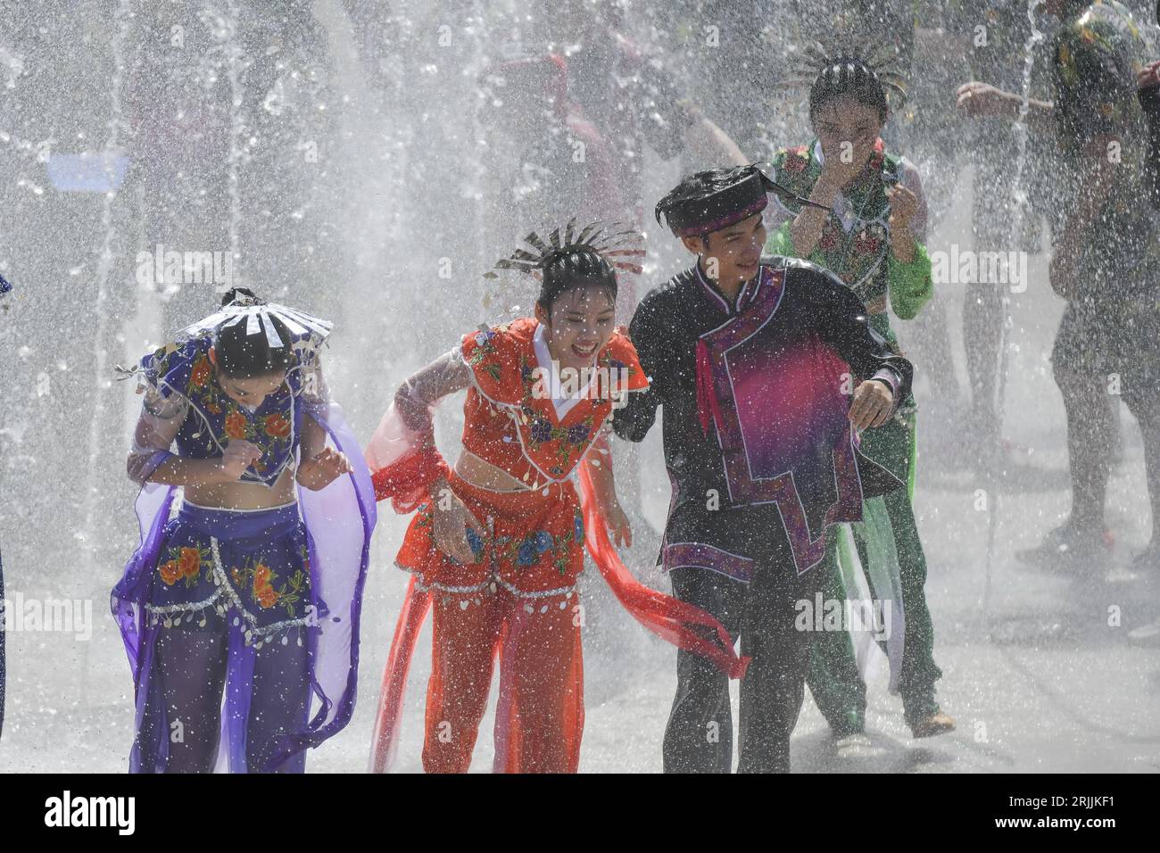 **CHINESE MAINLAND, HONG KONG, MACAU AND TAIWAN OUT** People splash hot ...