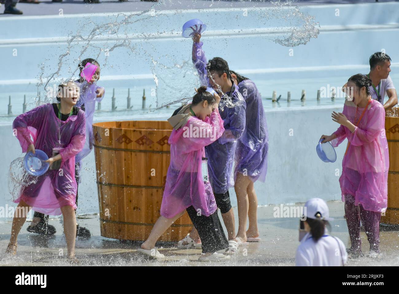 **CHINESE MAINLAND, HONG KONG, MACAU AND TAIWAN OUT** People splash hot ...